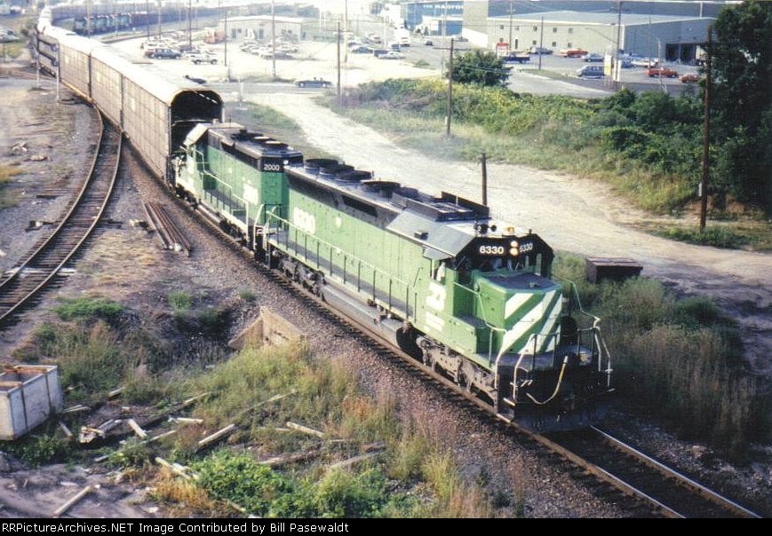 Caterpillar rebuild SD40C leads train #33 out of their yard
